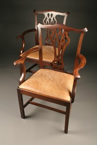 Pair of ornately carved German Hall chairs.